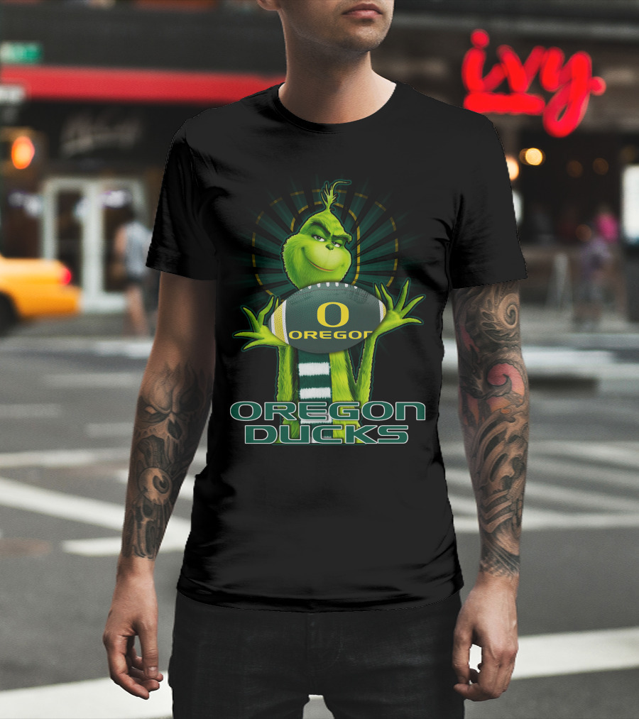 Grinch Holding Oregon Ducks Football T-Shirt