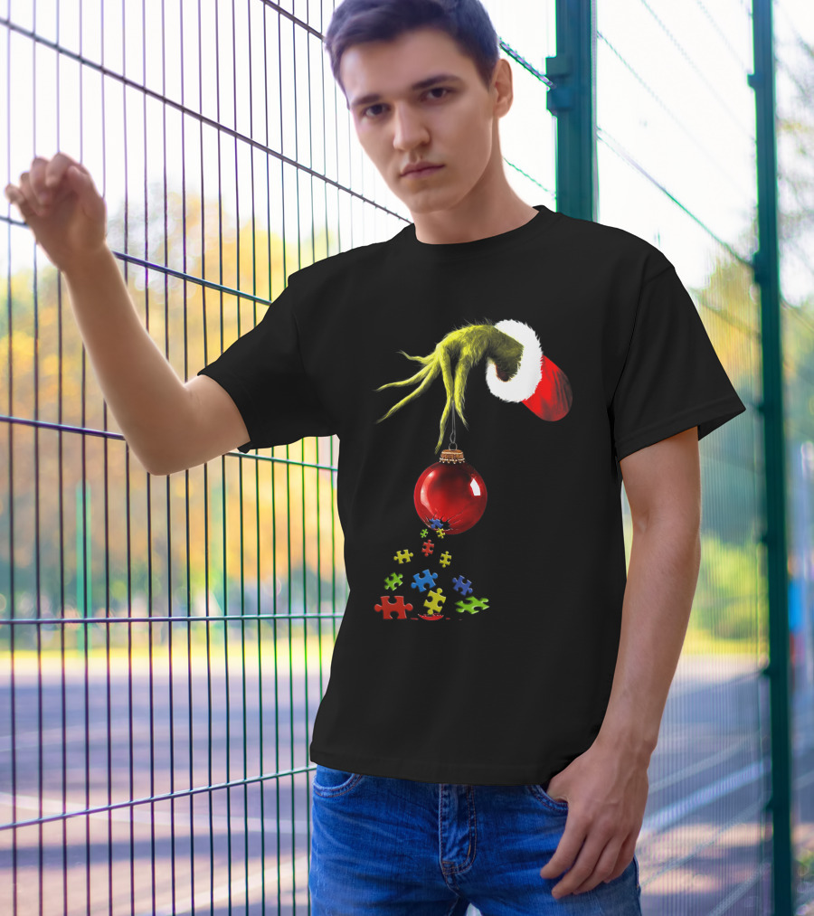 Grinch Hand Holding Red Ornament With Autism Puzzle Pieces T-Shirt