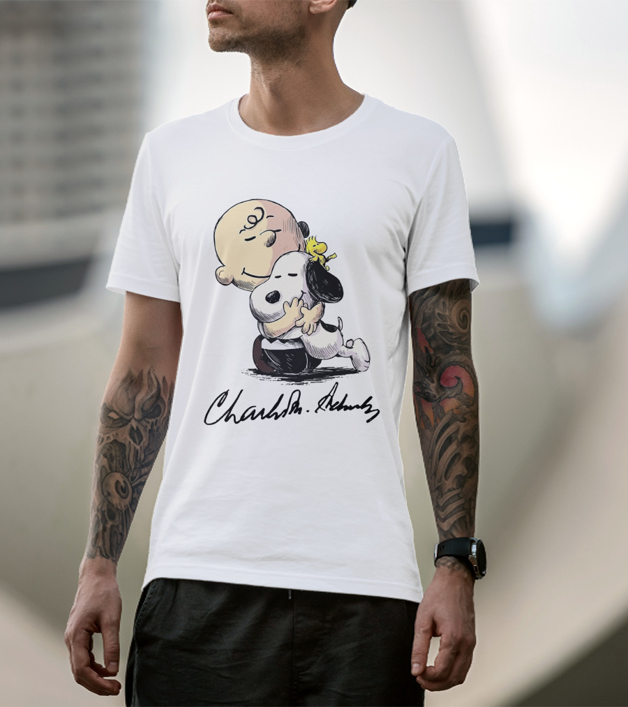 Snoopy And Charlie Brown Hugging By Charles M. Schulz T-Shirt