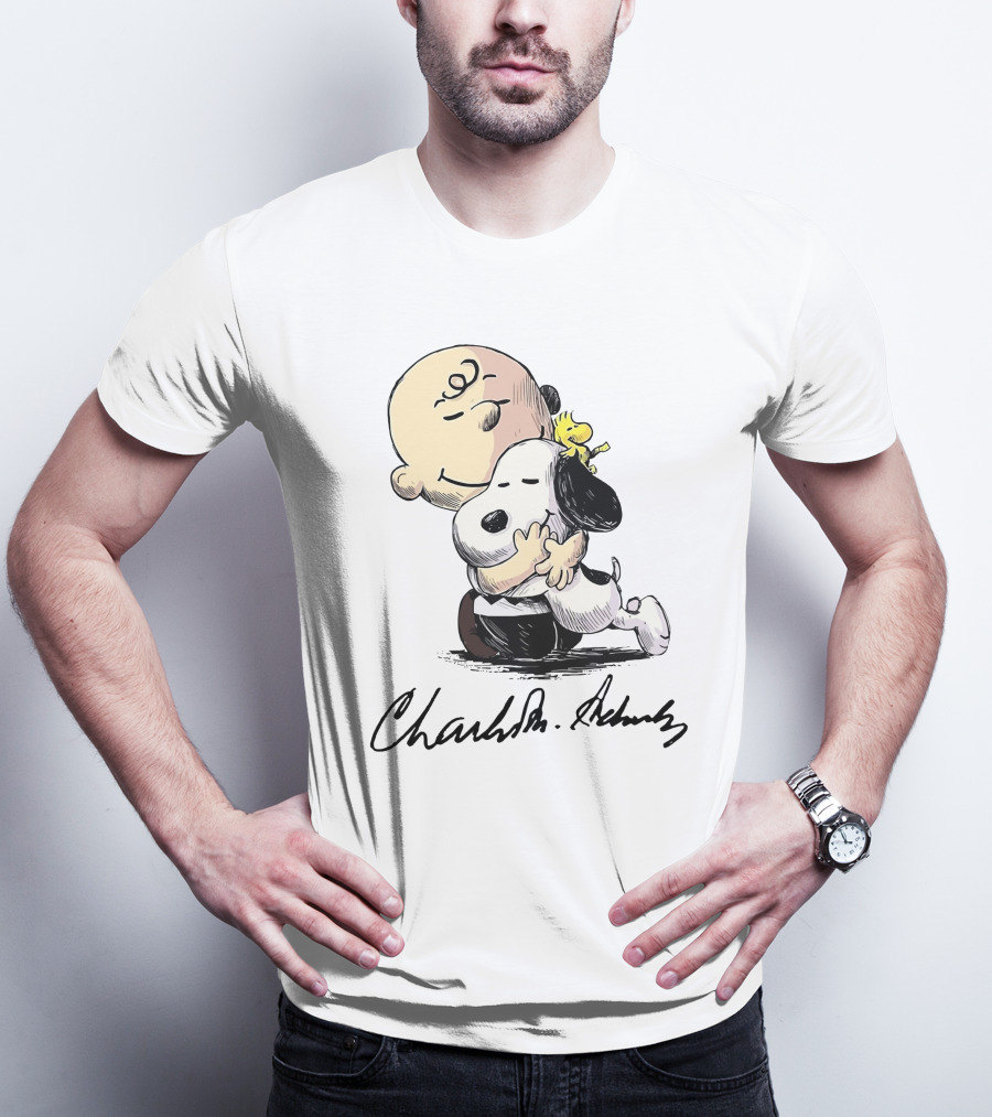 Snoopy And Charlie Brown Hugging By Charles M. Schulz T-Shirt