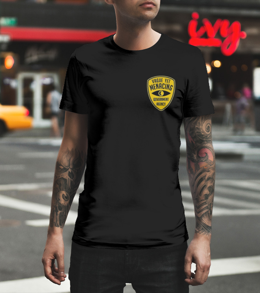 Vague Yet Menacing Government Agency Yellow Badge With Eye T-Shirt