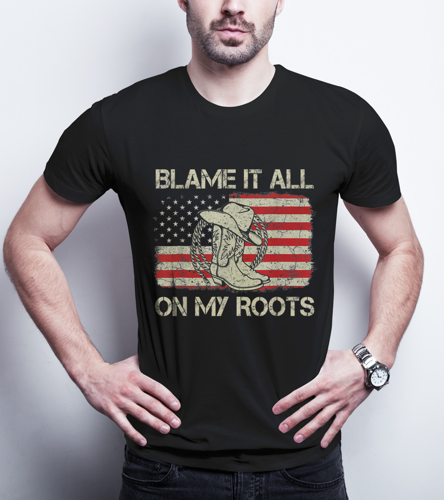 Blame It All On My Roots Cowboy Hat Boots American Flag Background T-Shirt
