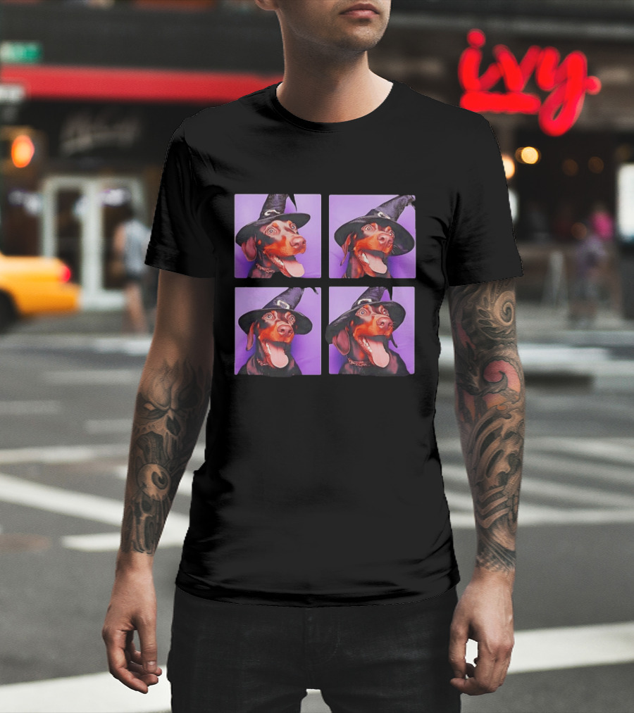 Doberman Pinscher In Witch Hat For Halloween With Purple T-Shirt