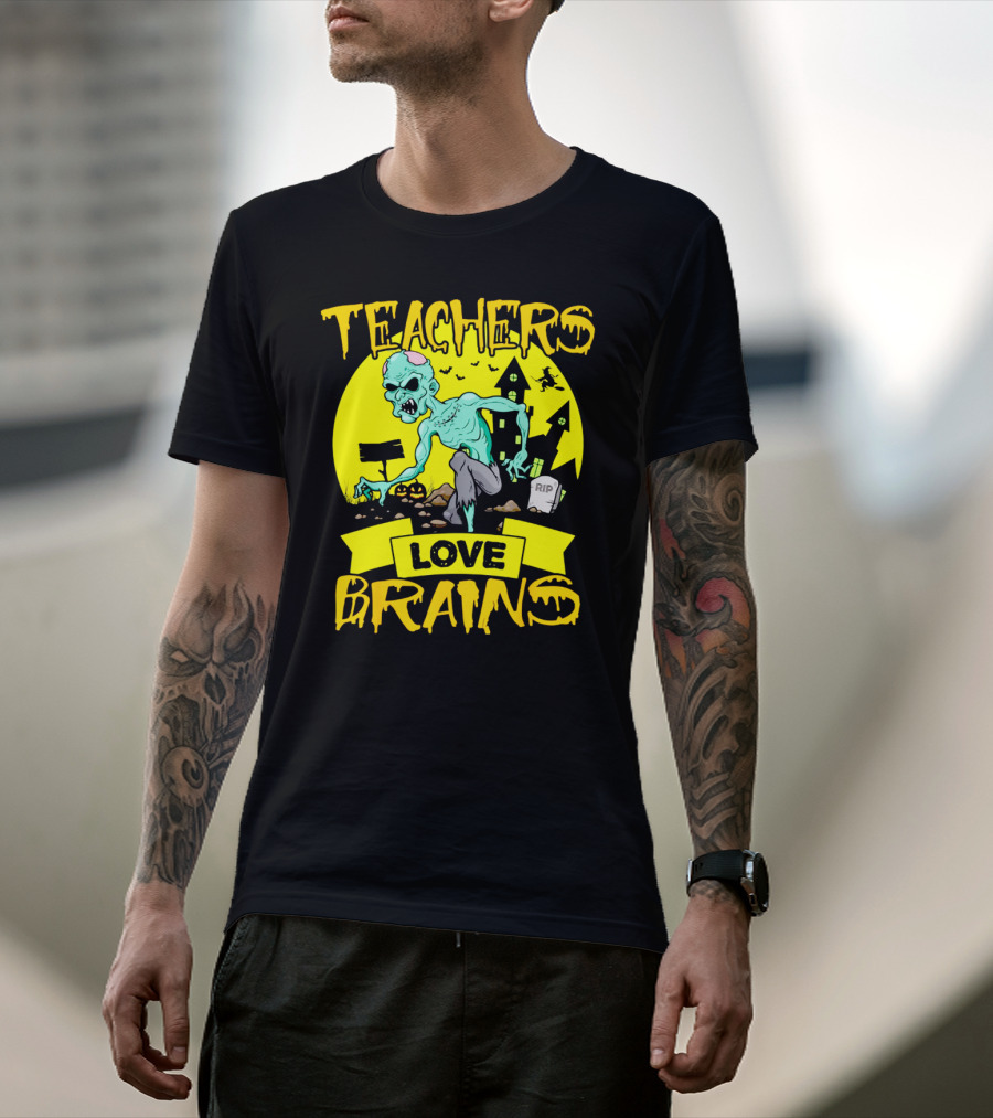 Teachers Love Brains Zombie Halloween Theme With Haunted Houses And Graveyard Background T-Shirt