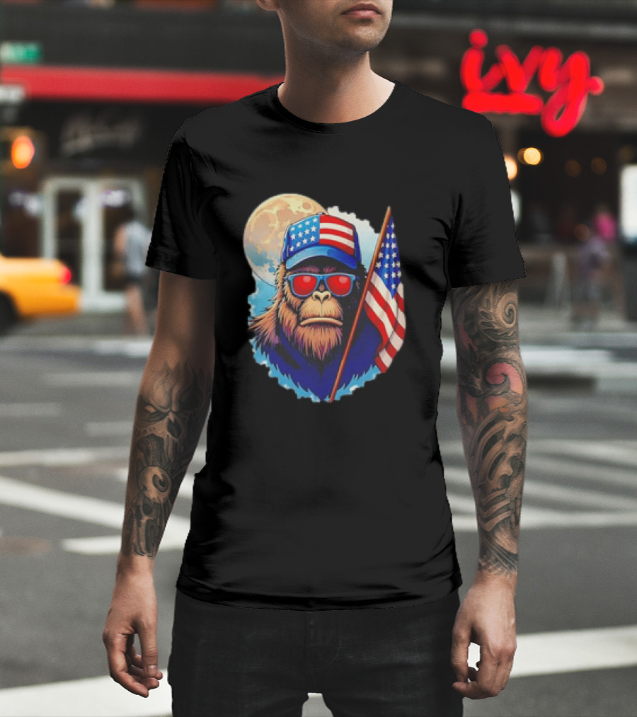 Bigfoot USA Flag Hat Sunglasses Patriotic Moon Background T-Shirt