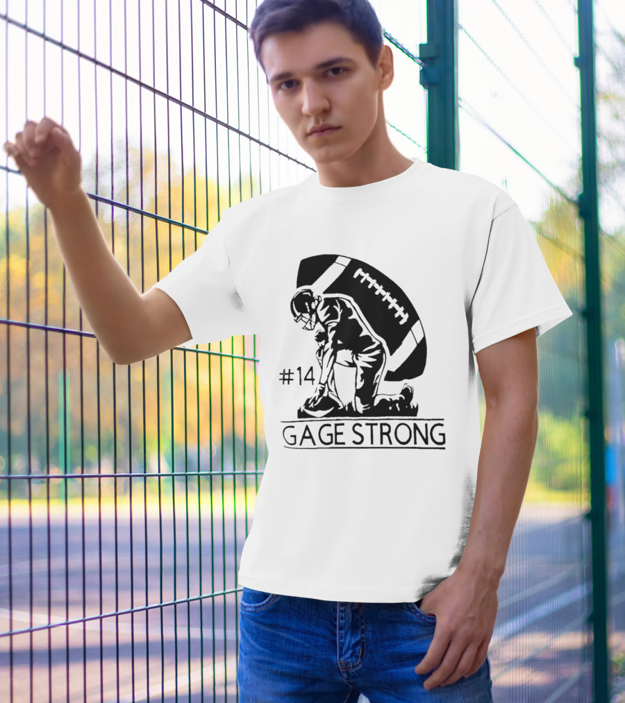 Gage Strong #14 Football Player Kneeling In Front Of Large Football T-Shirt