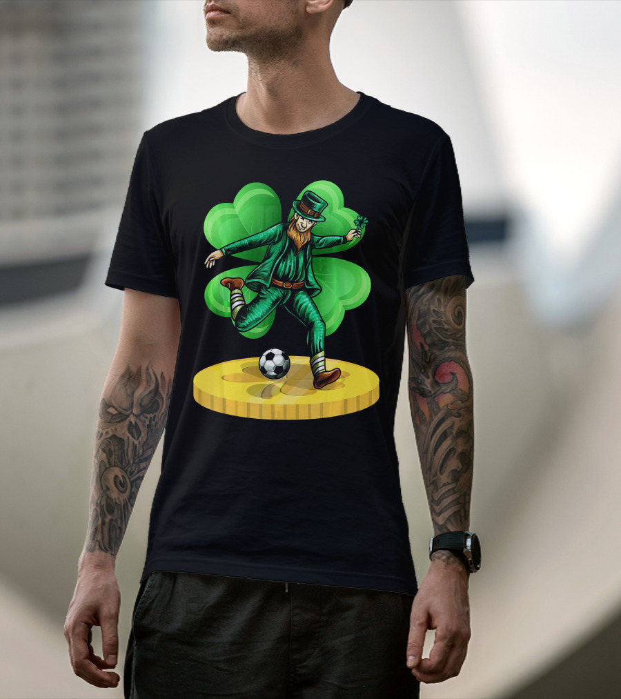 Leprechaun Kicking Soccer Ball On Gold Coin With Shamrock Background T-Shirt