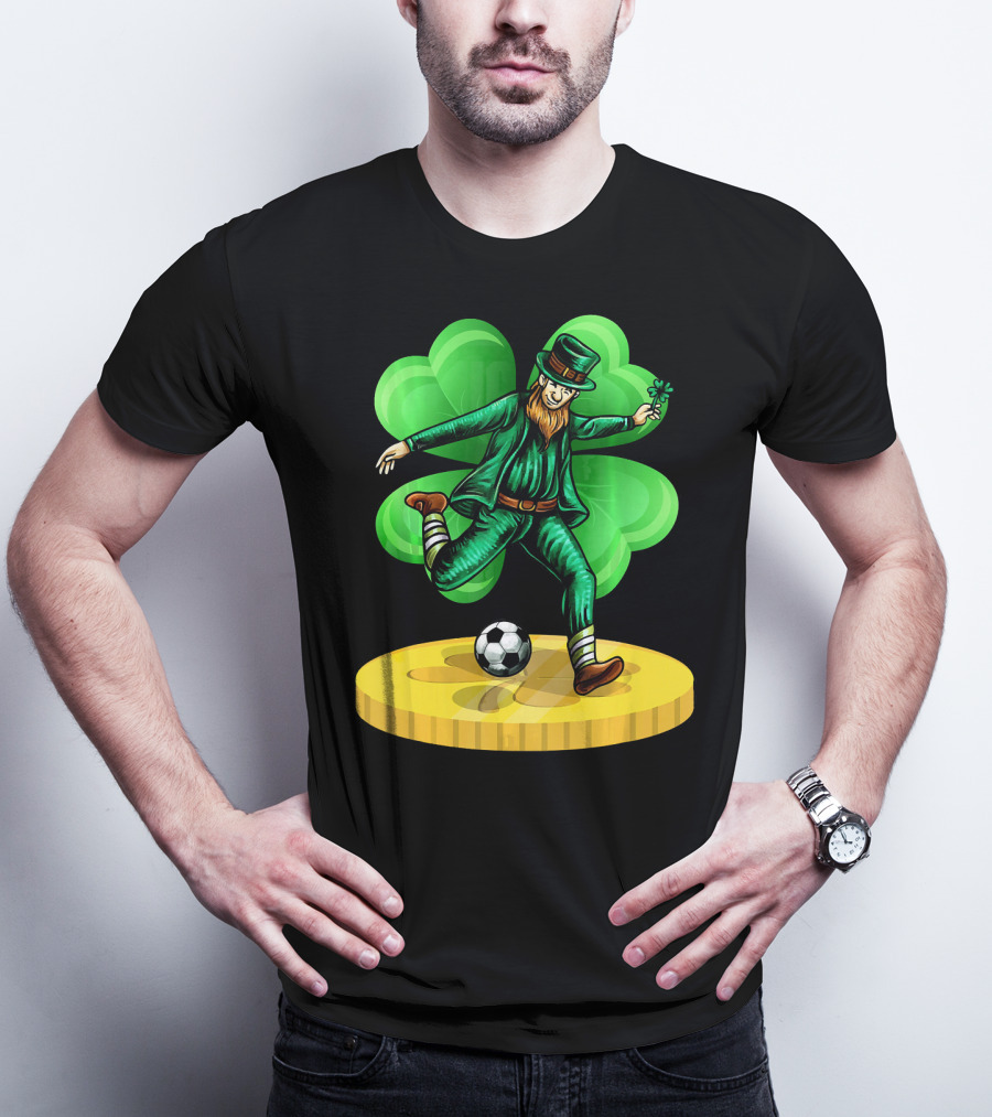 Leprechaun Kicking Soccer Ball On Gold Coin With Shamrock Background T-Shirt