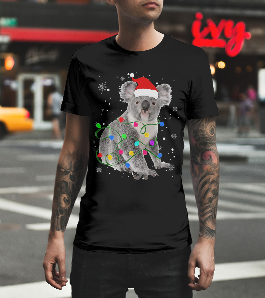 Koala Wrapped In Christmas Lights Wearing Santa Hat With Snowflakes Matching Fam T-Shirt