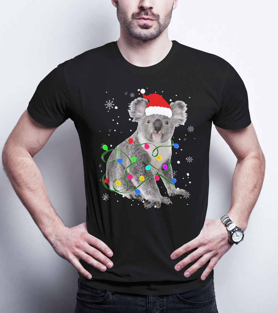 Koala Wrapped In Christmas Lights Wearing Santa Hat With Snowflakes Matching Fam T-Shirt