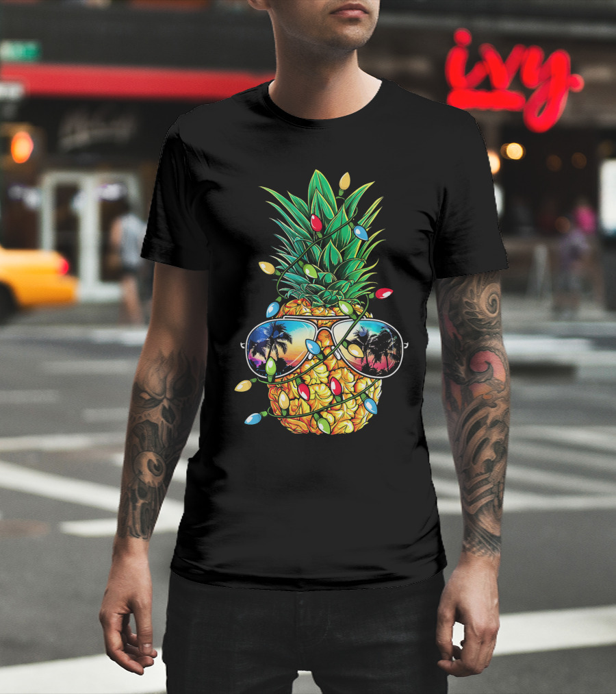 Pineapple Wrapped In Christmas Lights With Sunglasses Reflected Sunset And Palm Trees T-Shirt