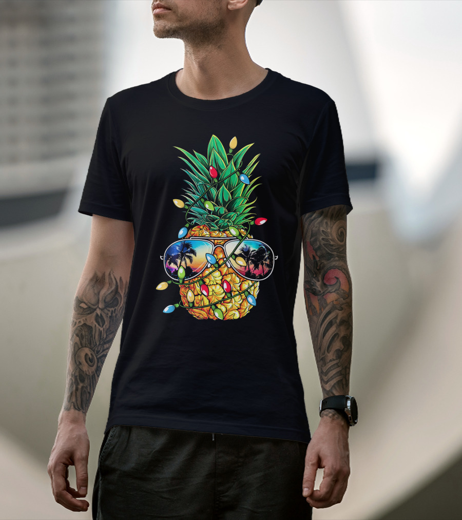 Pineapple Wrapped In Christmas Lights With Sunglasses Reflected Sunset And Palm Trees T-Shirt
