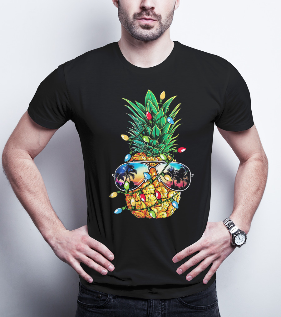 Pineapple Wrapped In Christmas Lights With Sunglasses Reflected Sunset And Palm Trees T-Shirt