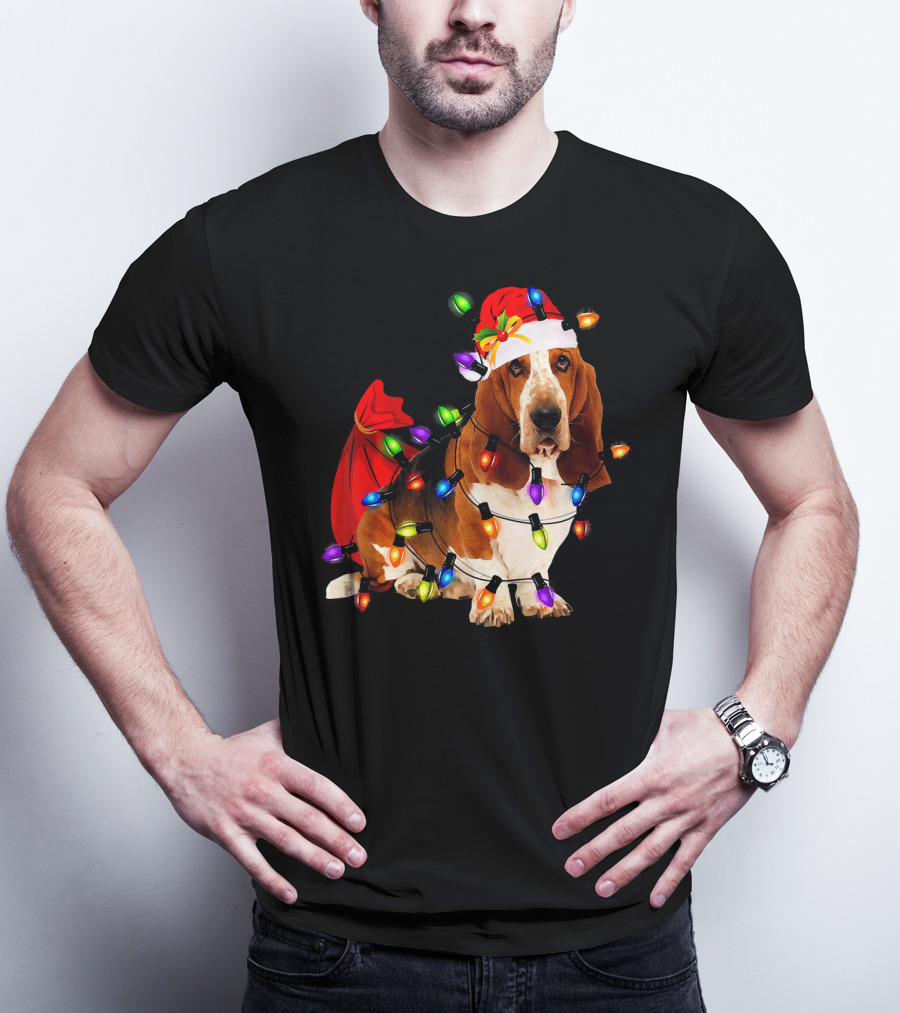Basset Hound Wrapped In Christmas Lights With Santa Hat And Red Sack T-Shirt