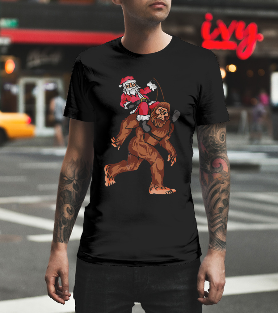 Bigfoot Carrying Santa Claus In Christmas T-Shirt