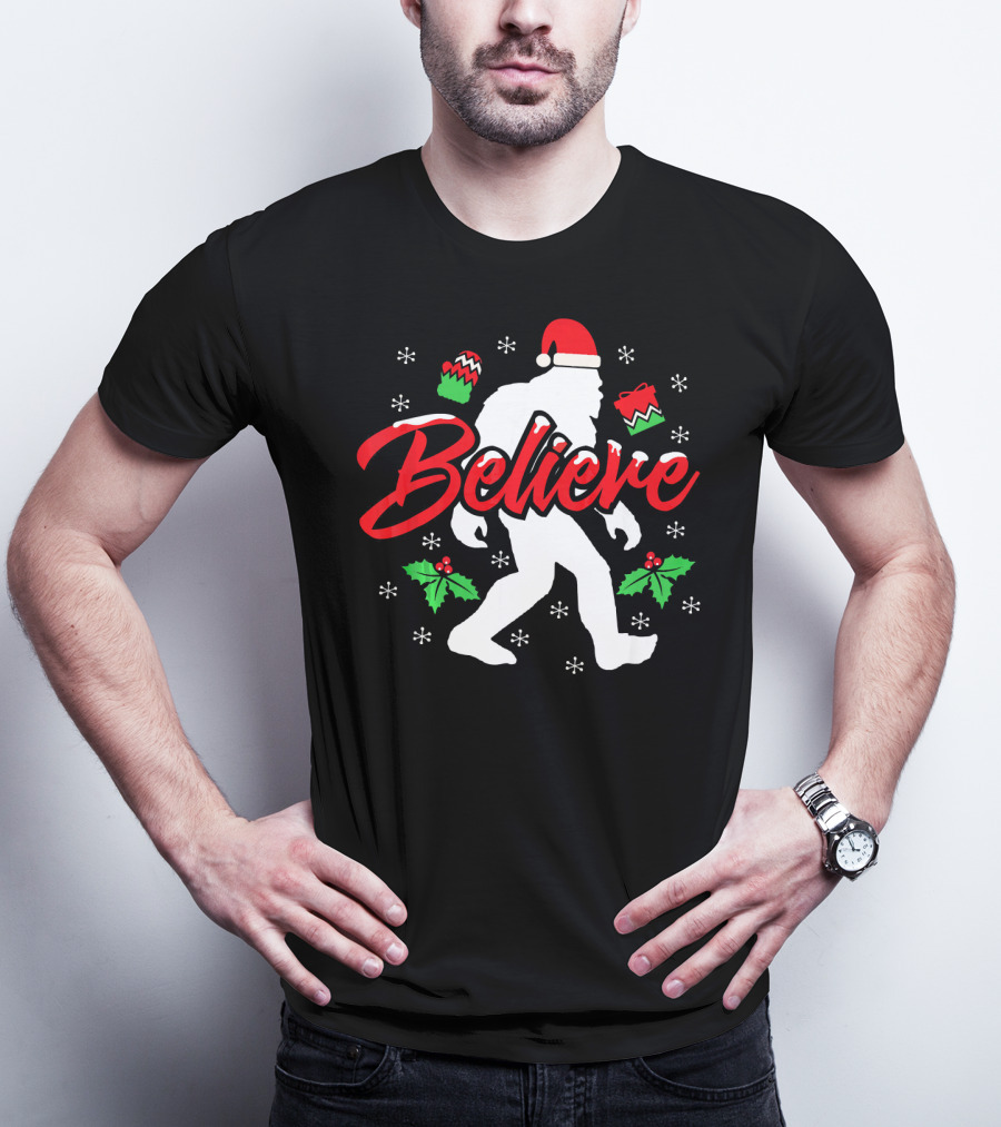 Believe Bigfoot Christmas Santa Hat Snowflakes Holly T-Shirt