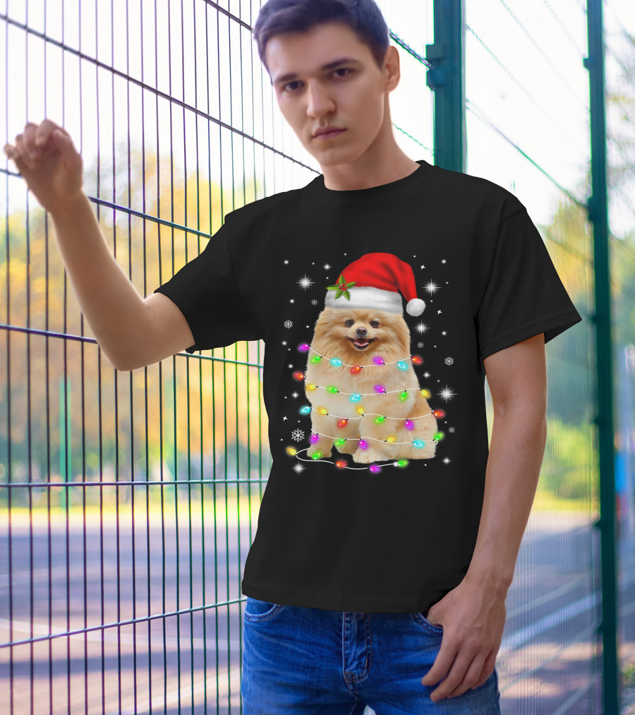Pomeranian Pup Wrapped In Christmas Lights With Santa Hat And Festive Glow T-Shirt